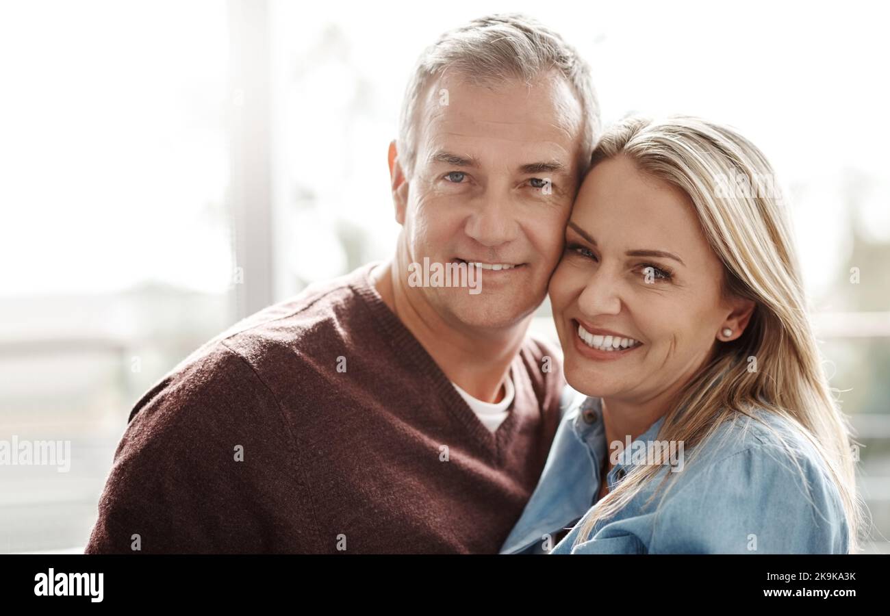 The secret to a happy marriage, keep each other smiling. Portrait of a ...