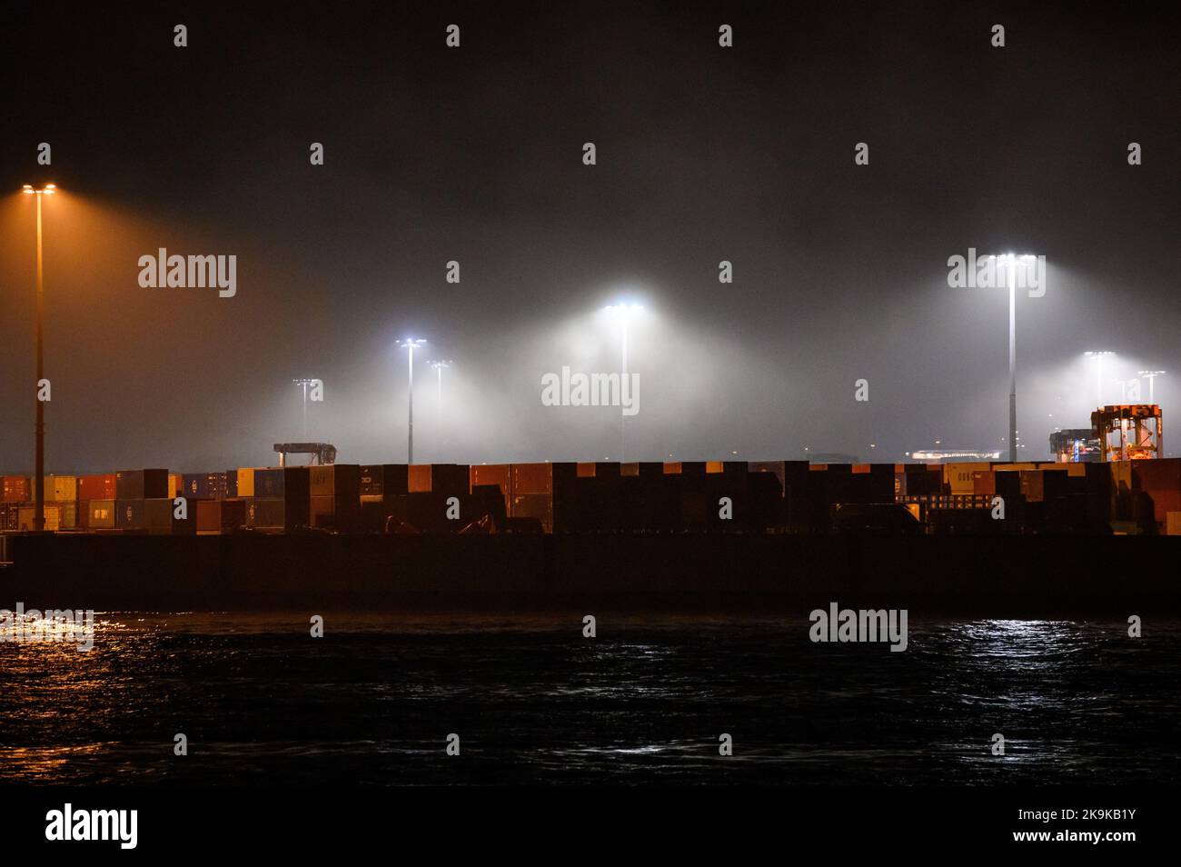 Hamburg, Germany. 26th Oct, 2022. The Tollerort container terminal in the morning fog. In the ...