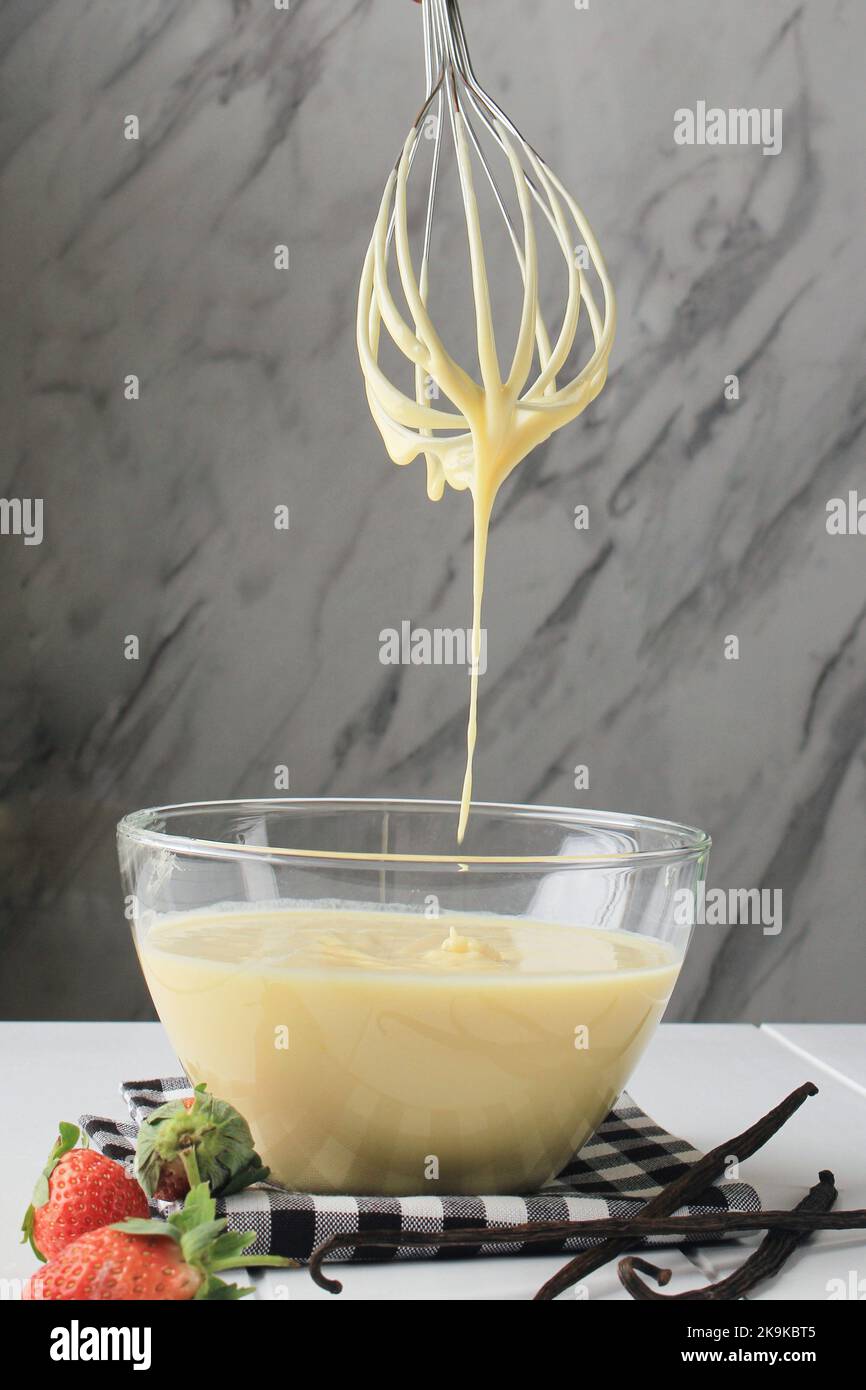 Cake Mixture on Clear Baking Mix Bowl, Beaten using Whisker Stock Photo ...