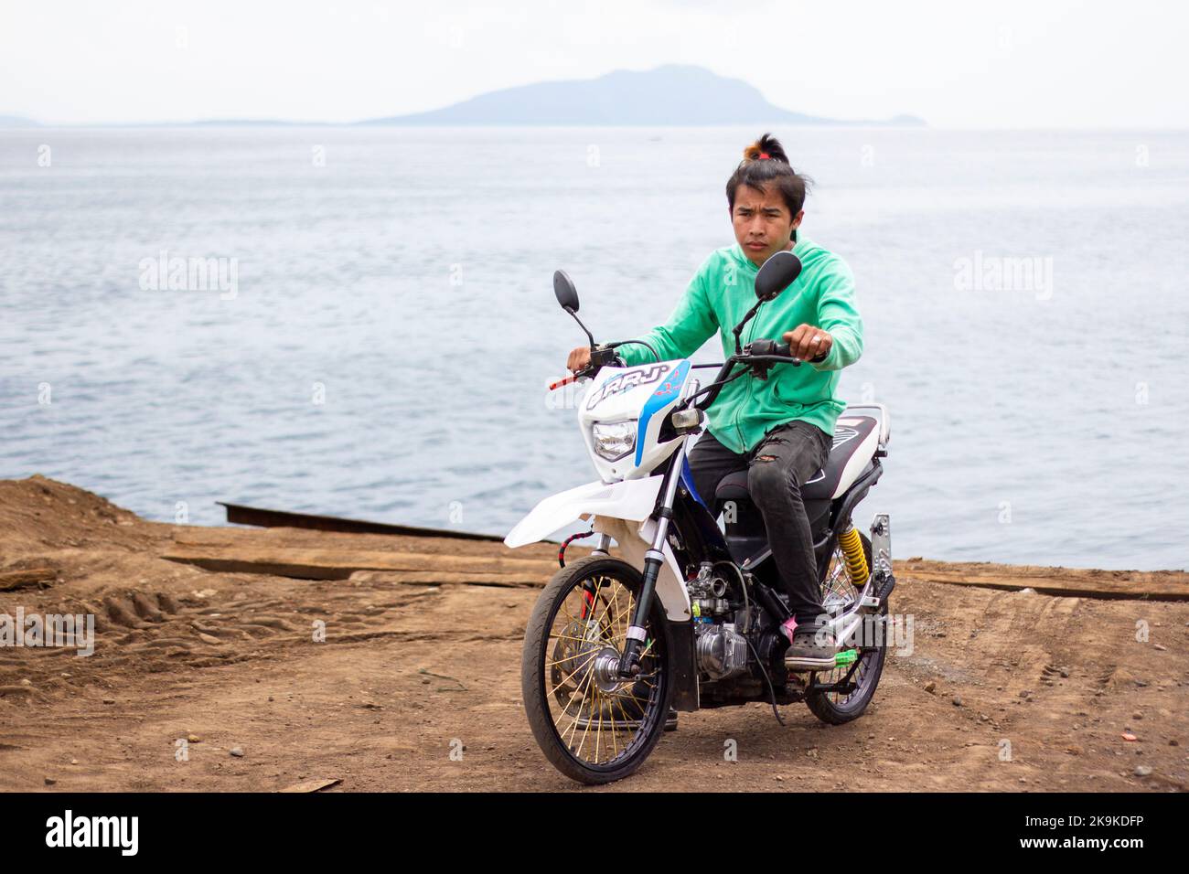 A Filipino driving his motorbike in Basilan, Philippines Stock Photo ...