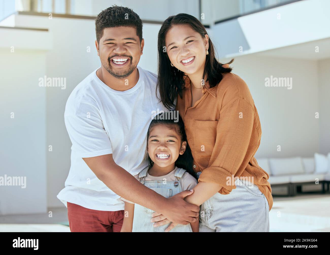 Family, mother and father hug child, happy in portrait together outdoor ...