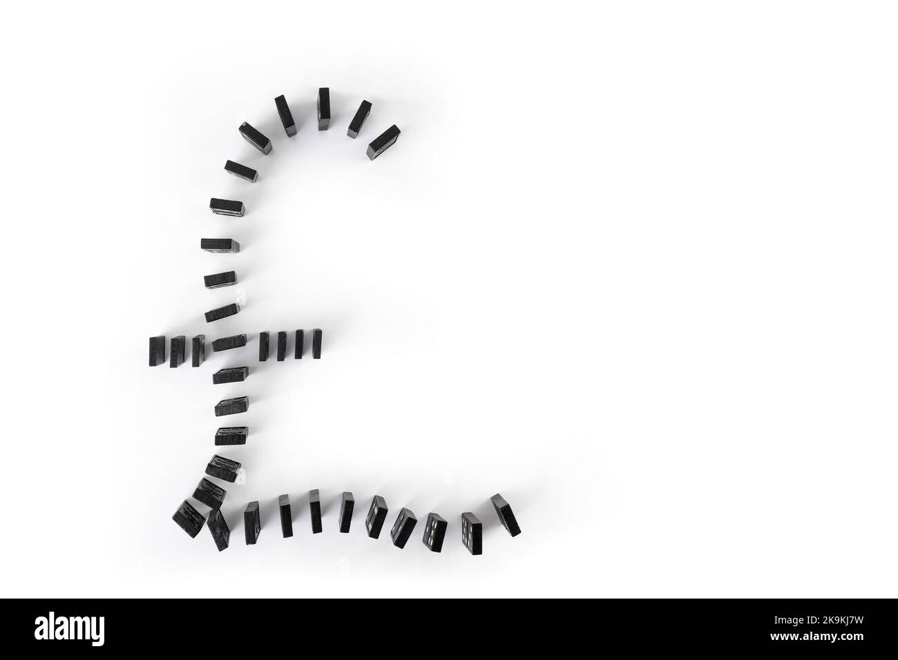 Domino black tiles arranged in the form of england currency symbol, on ...