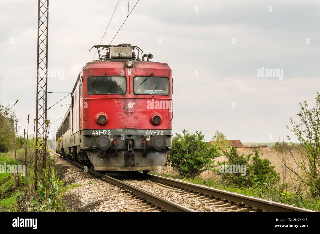 An old electric train passes through the populated area of Petrovaradin ...