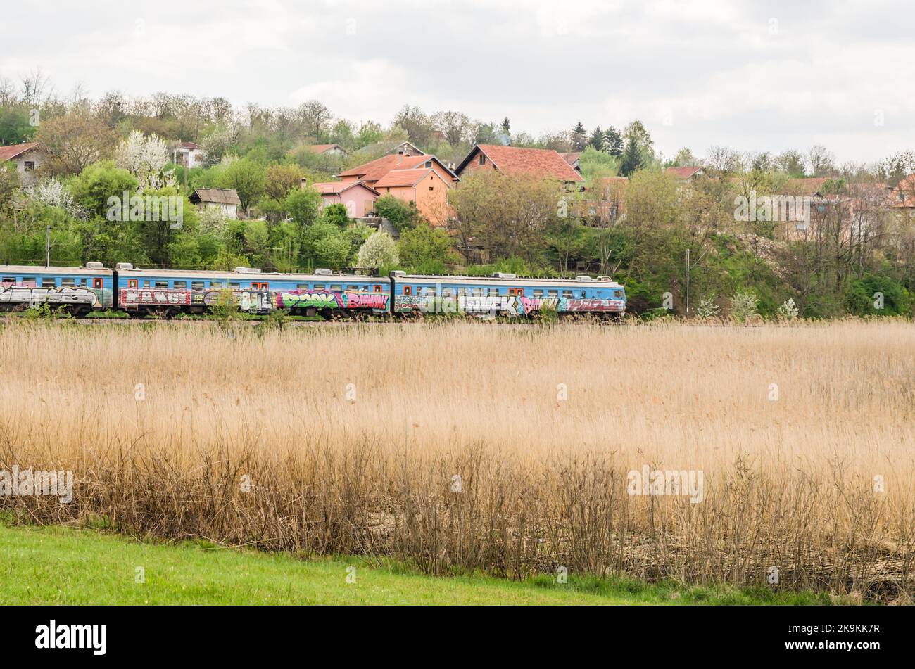 An old electric train passes through the populated area of Petrovaradin ...