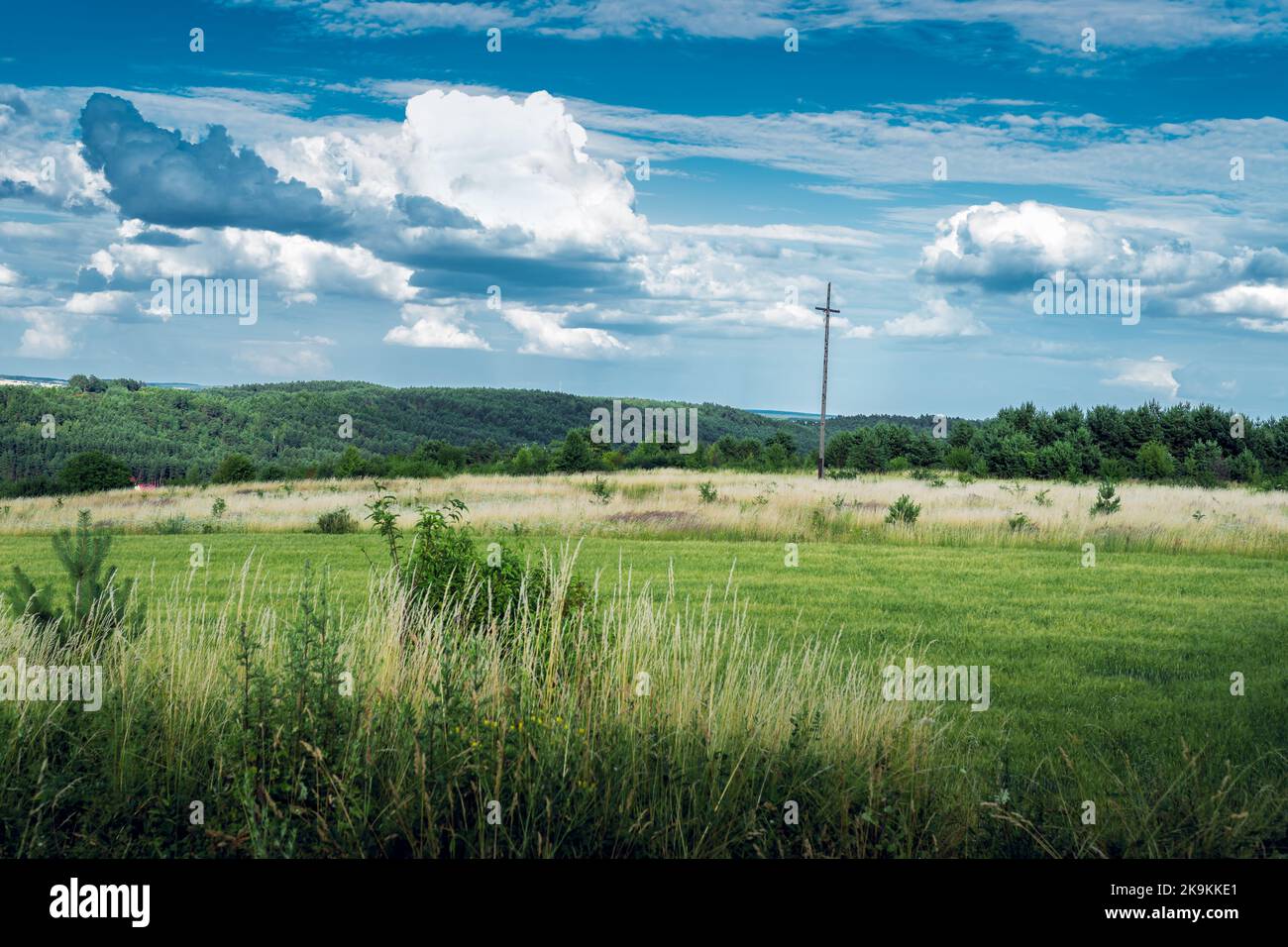 Cross on the hill. Forests, meadows and fields. A beautiful landscape ...