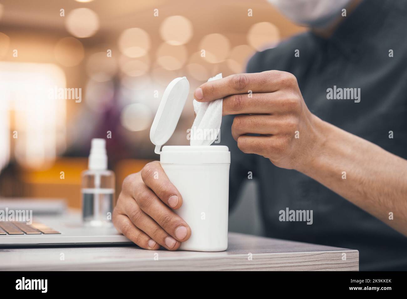 close up. young man using antiseptic wipes Stock Photo - Alamy
