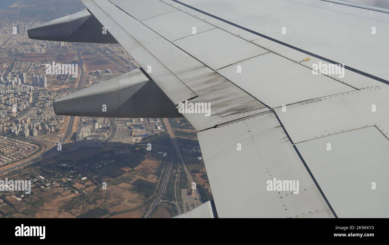 Wing of an airplane flying over Israel, Passenger s view. Looking ...