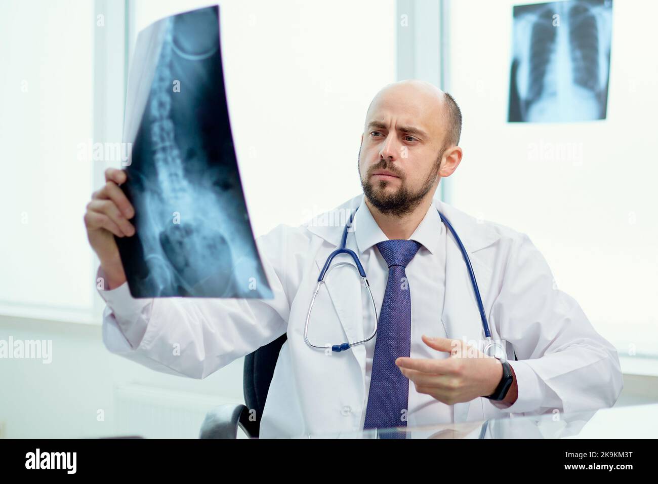 doctor is carefully looking at the X-ray Stock Photo - Alamy