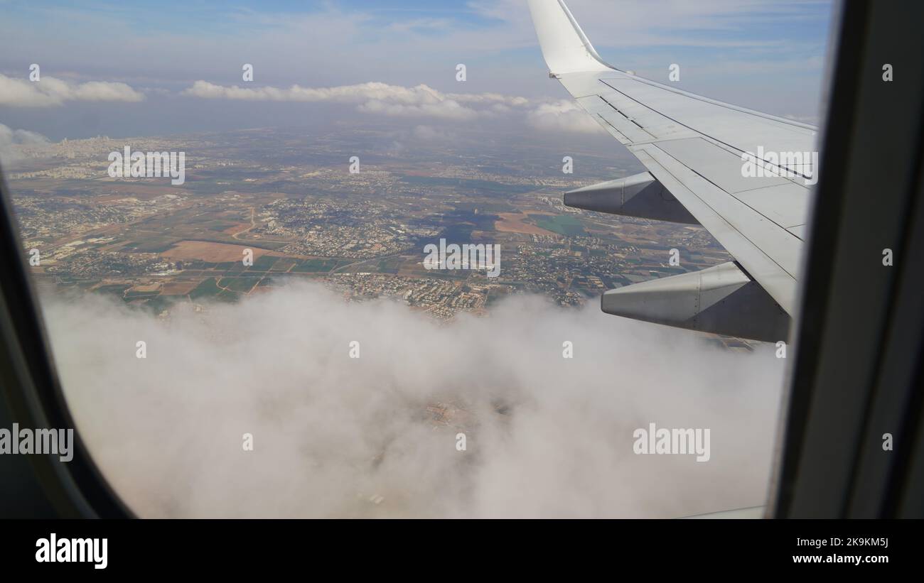 Wing of an airplane flying over Israel, Passenger s view. Looking ...