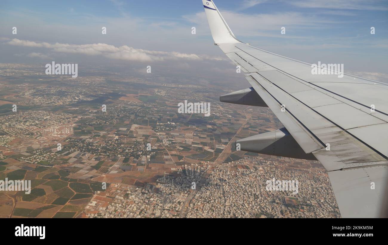 Wing of an airplane flying over Israel, Passenger s view. Looking ...