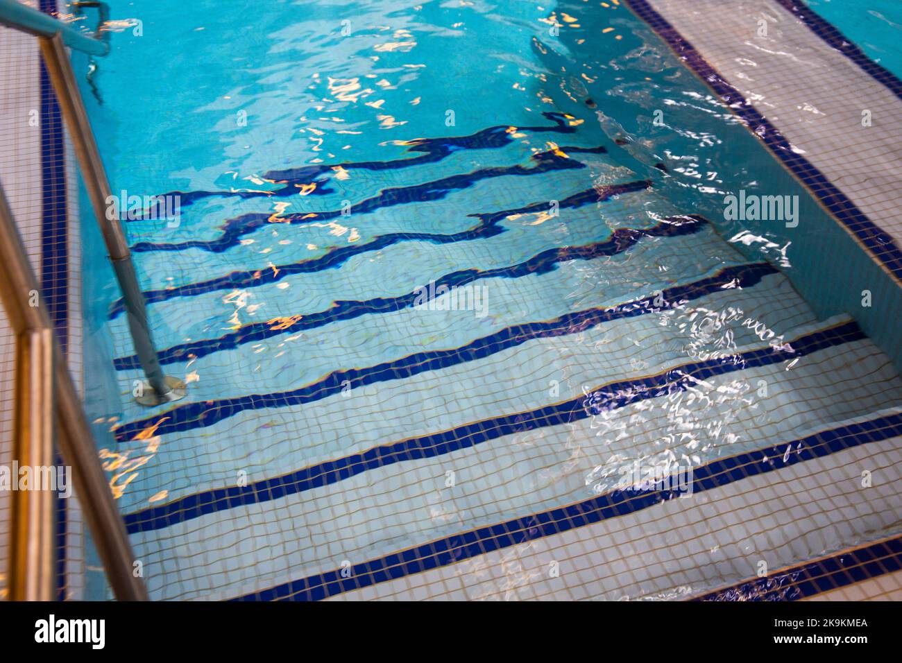 Swimming pool stairs at the entrance of a swimmers pool Stock Photo - Alamy