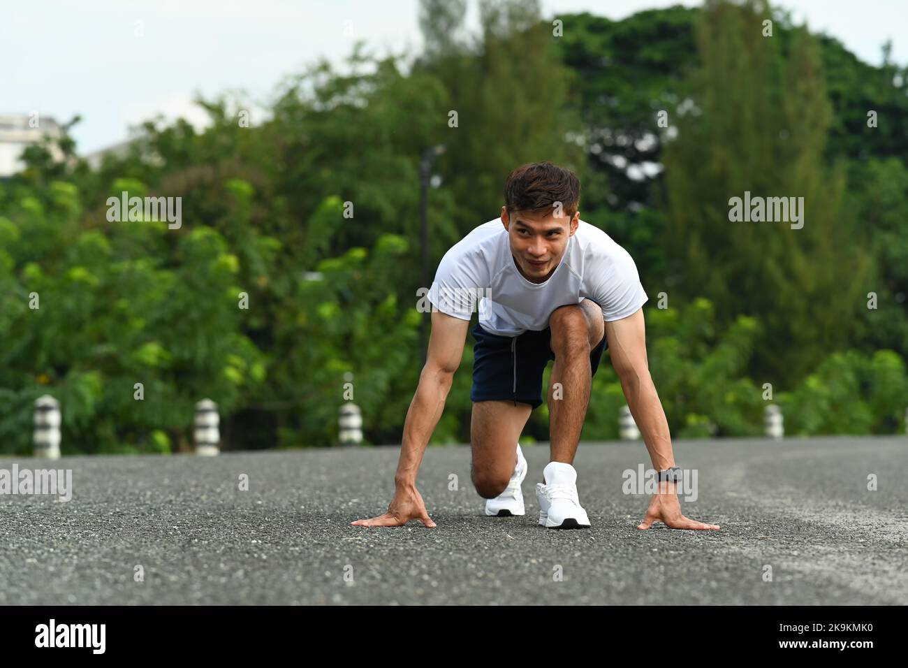 Man at running track in starting position hi-res stock photography and ...