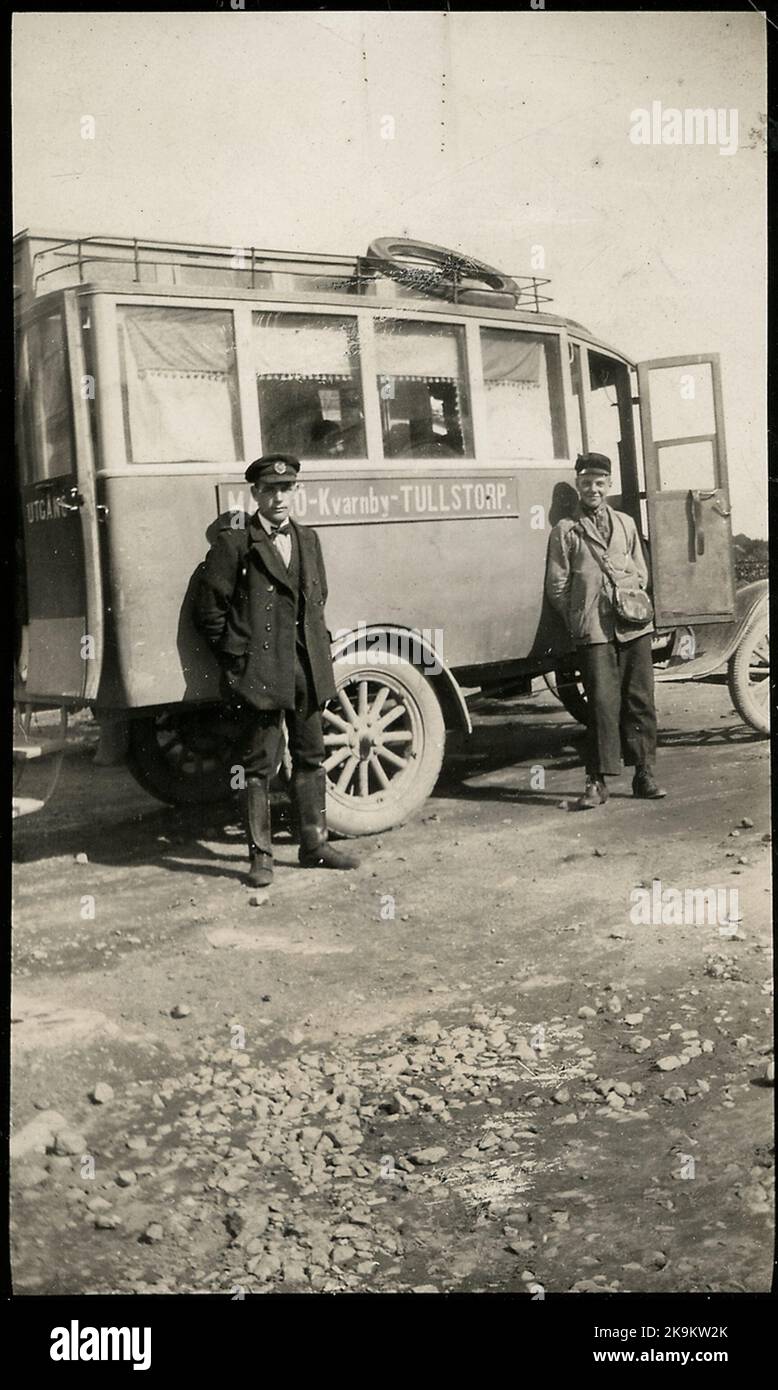 Driver and conductor outside a bus that operates line Malmö - Kvarnby ...
