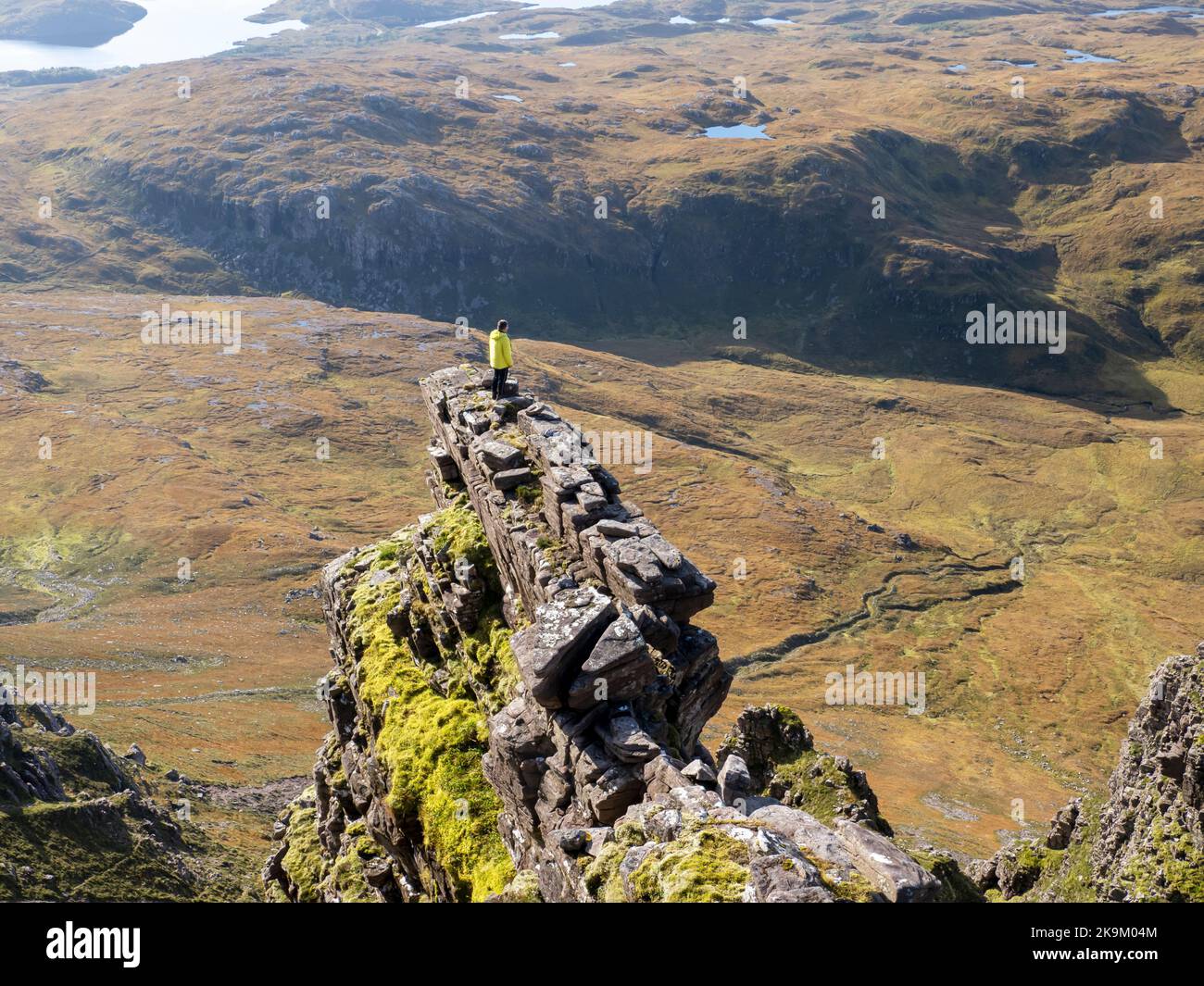 A climber on an exposed ridge on Quinag in Assynt, Scotland, UK Stock ...