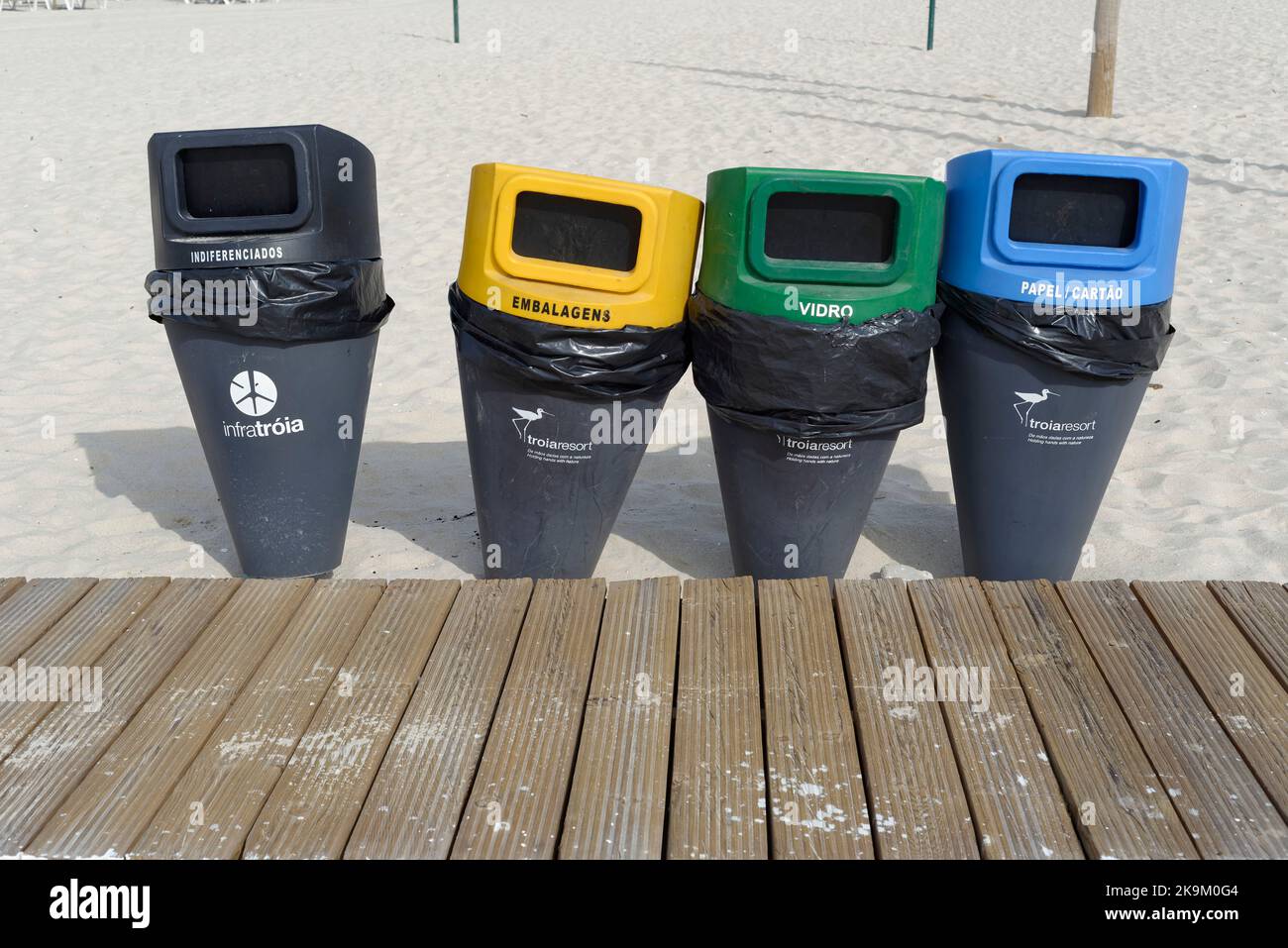 recycle bins on a beach Stock Photo - Alamy