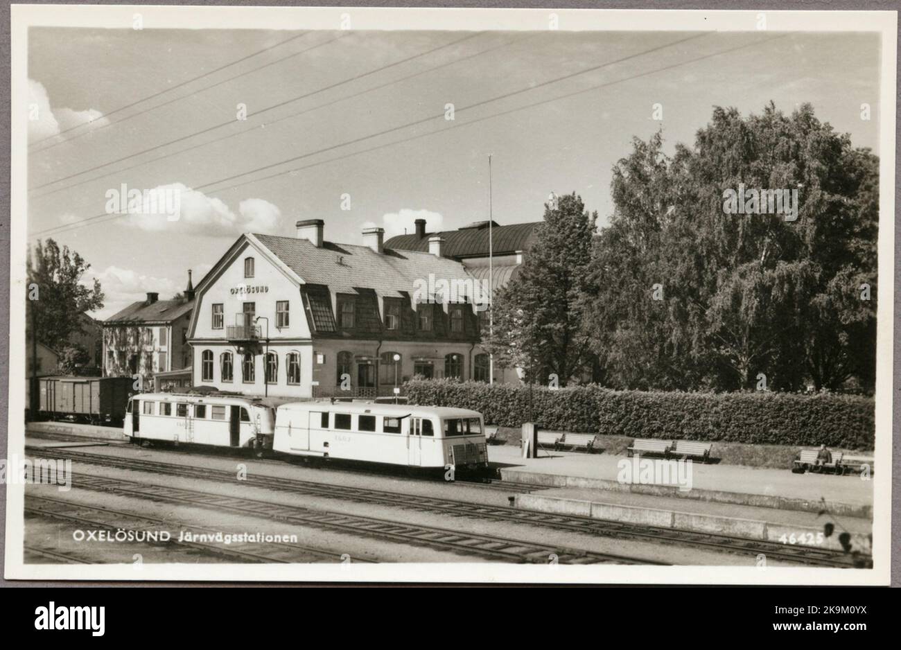 Station area and platform with motor cars in picture Stock Photo - Alamy