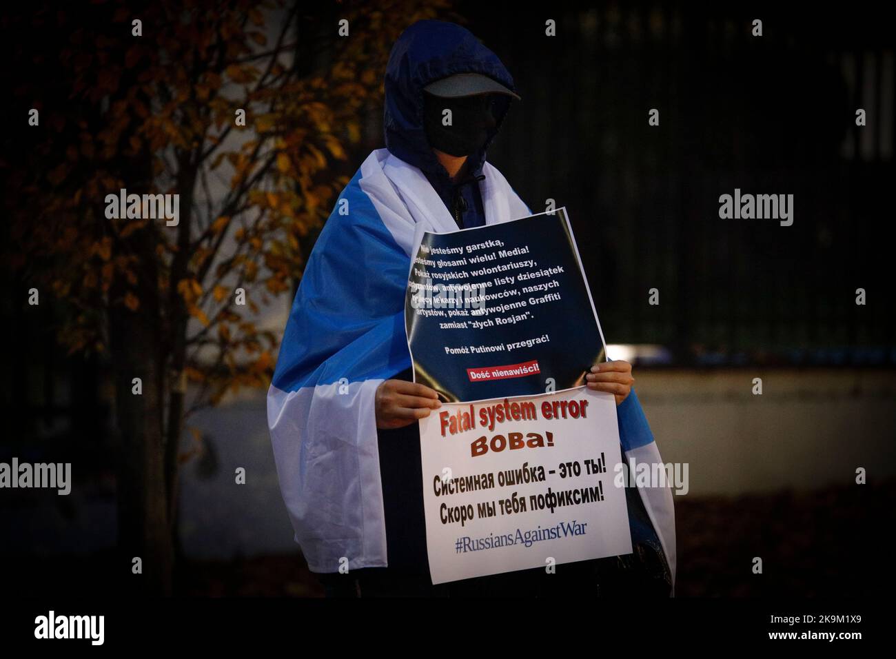 A woman wearing the white-blue-white Russian flag, a sumbol against the ...
