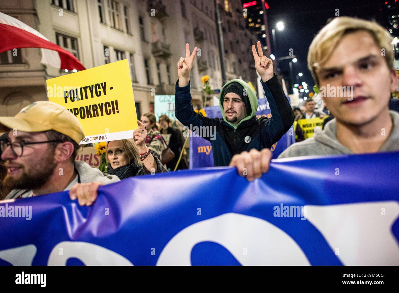 A protester makes gestures while marching through the Streets during ...
