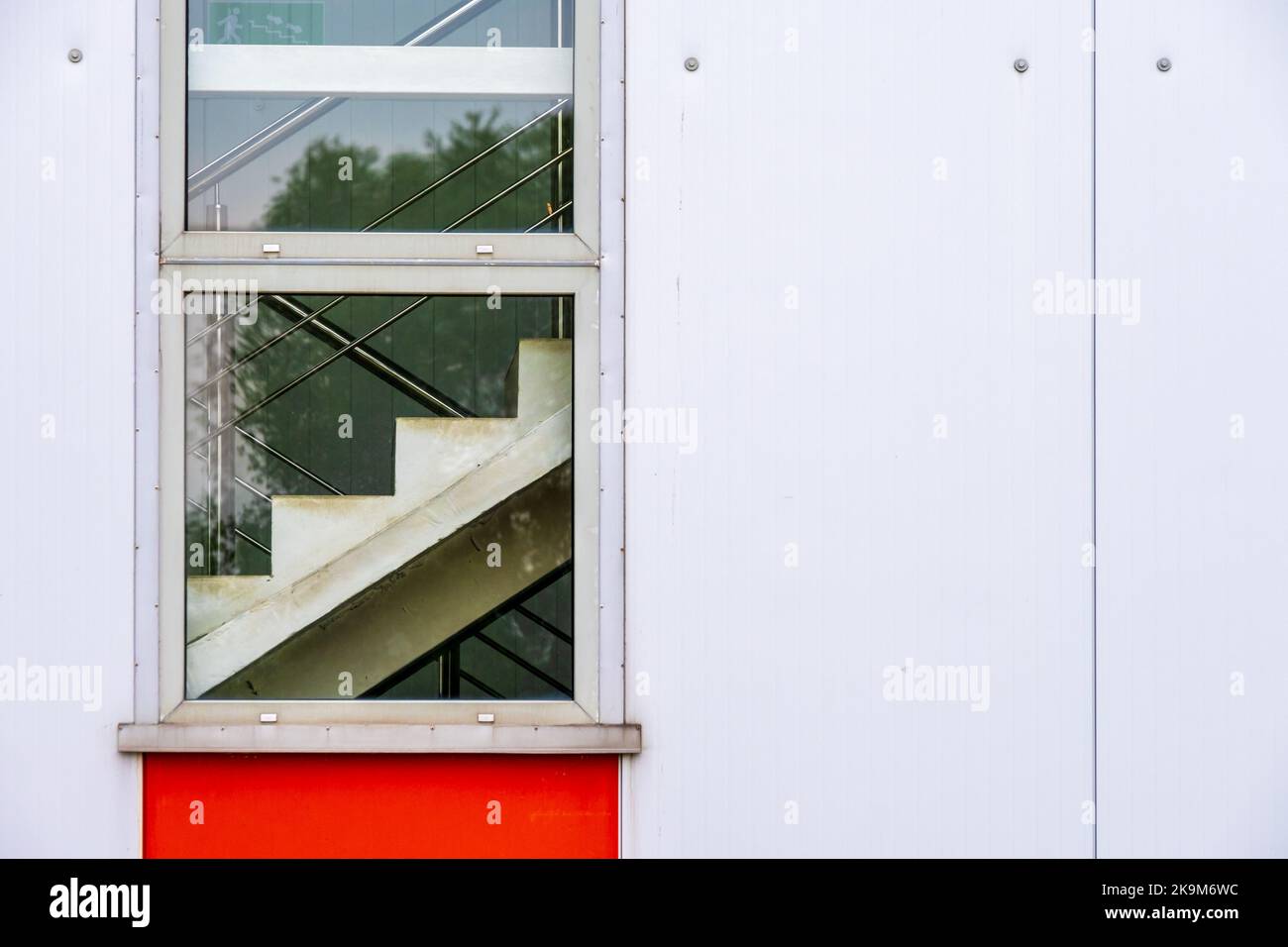 Staircase behind window of house Stock Photo - Alamy