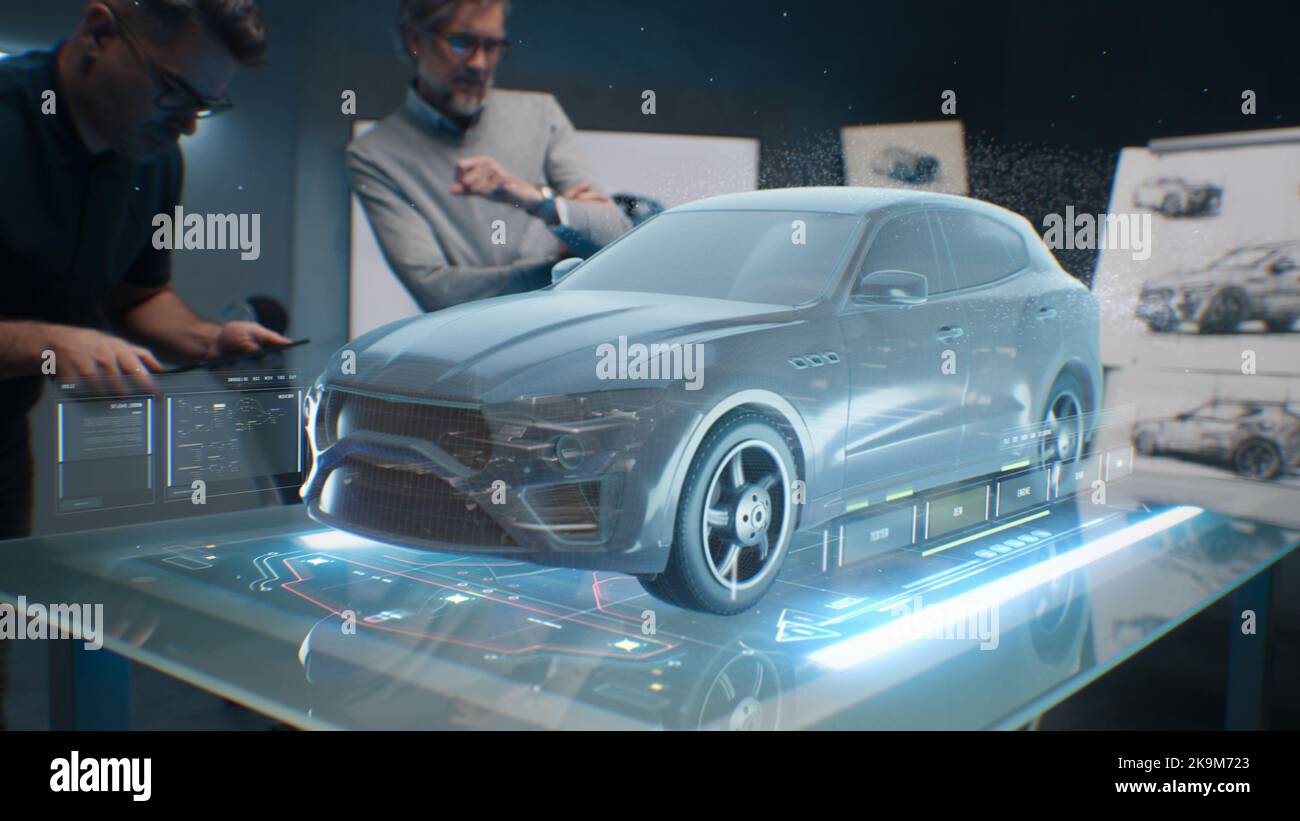 Two male engineers using digital tablet App, developing 3D model of a ...