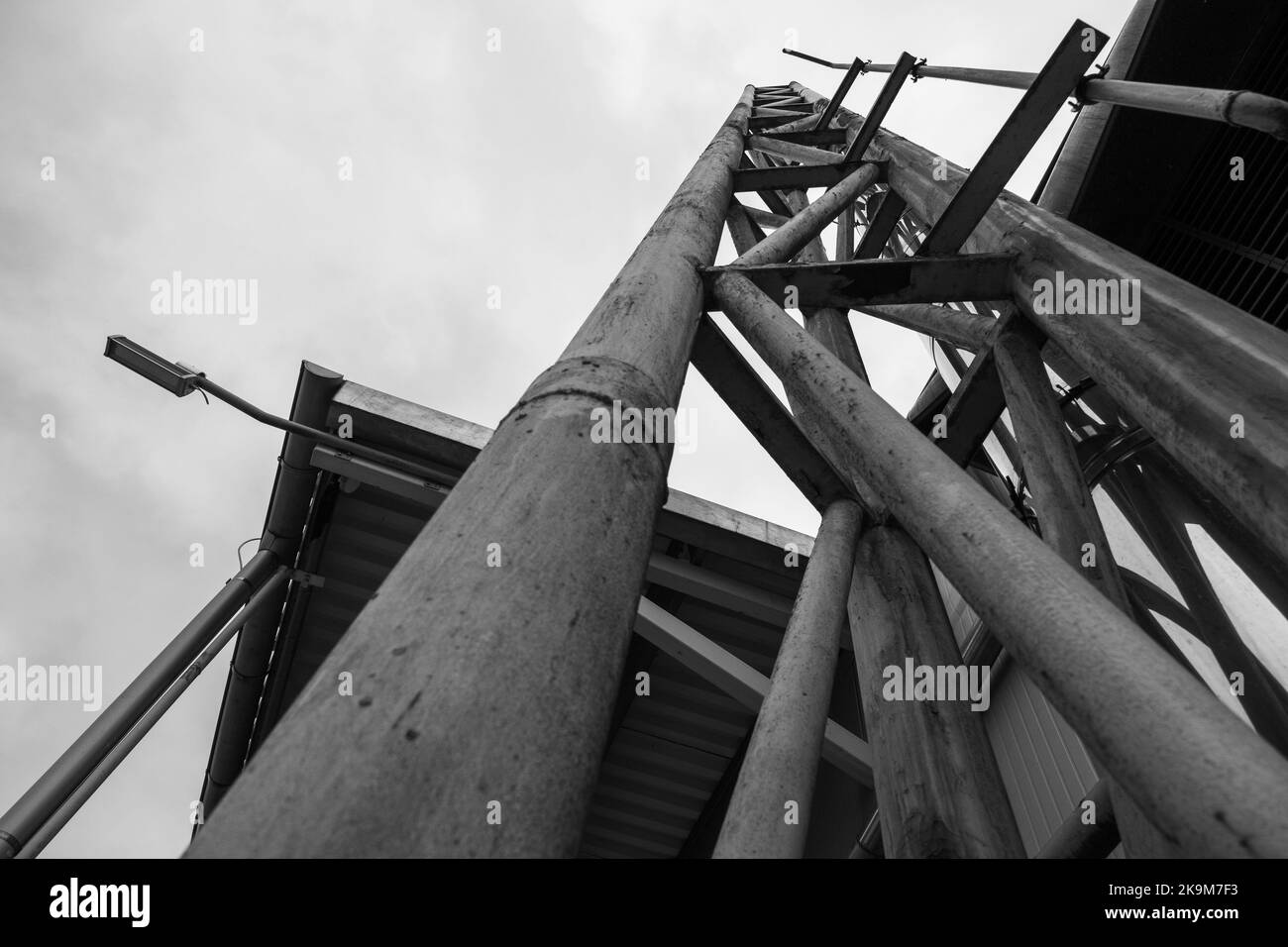 Pipeline near wall industrial building Stock Photo - Alamy