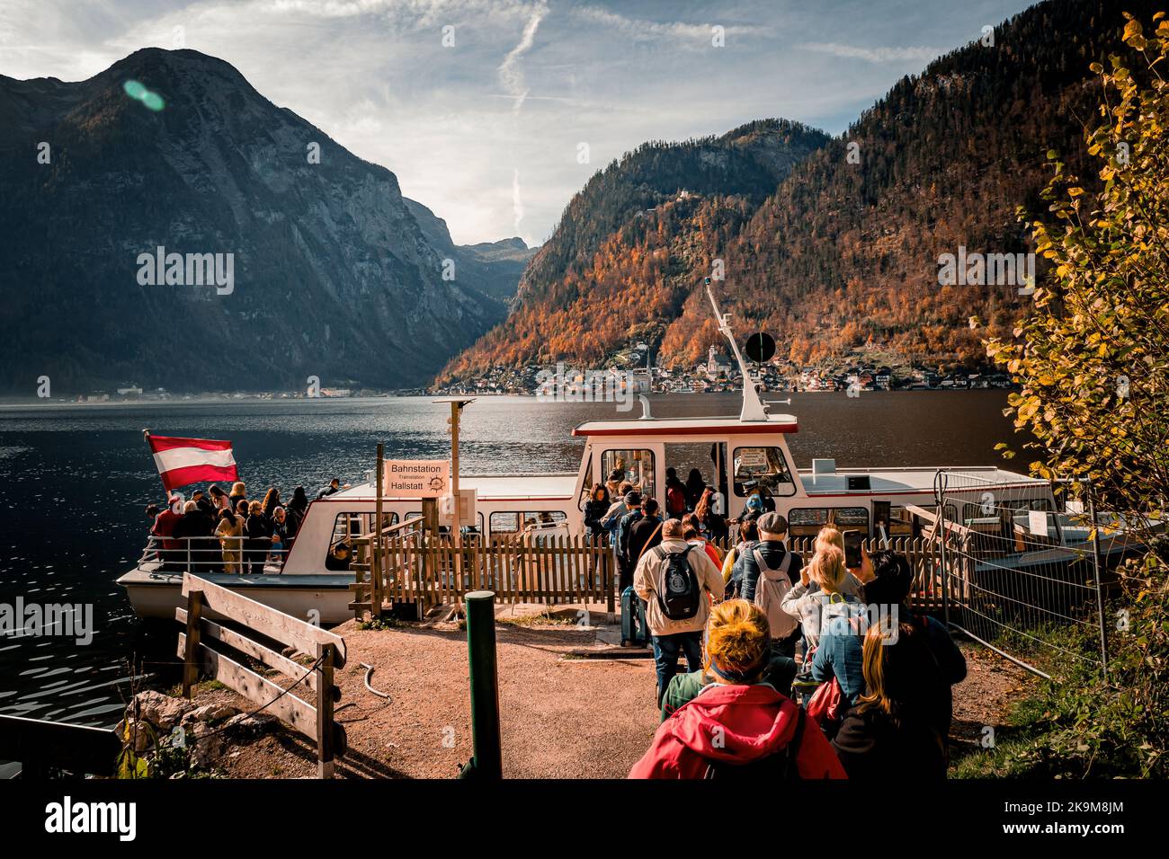 Autumn view of the Hallstatt train station landing stage on the other ...