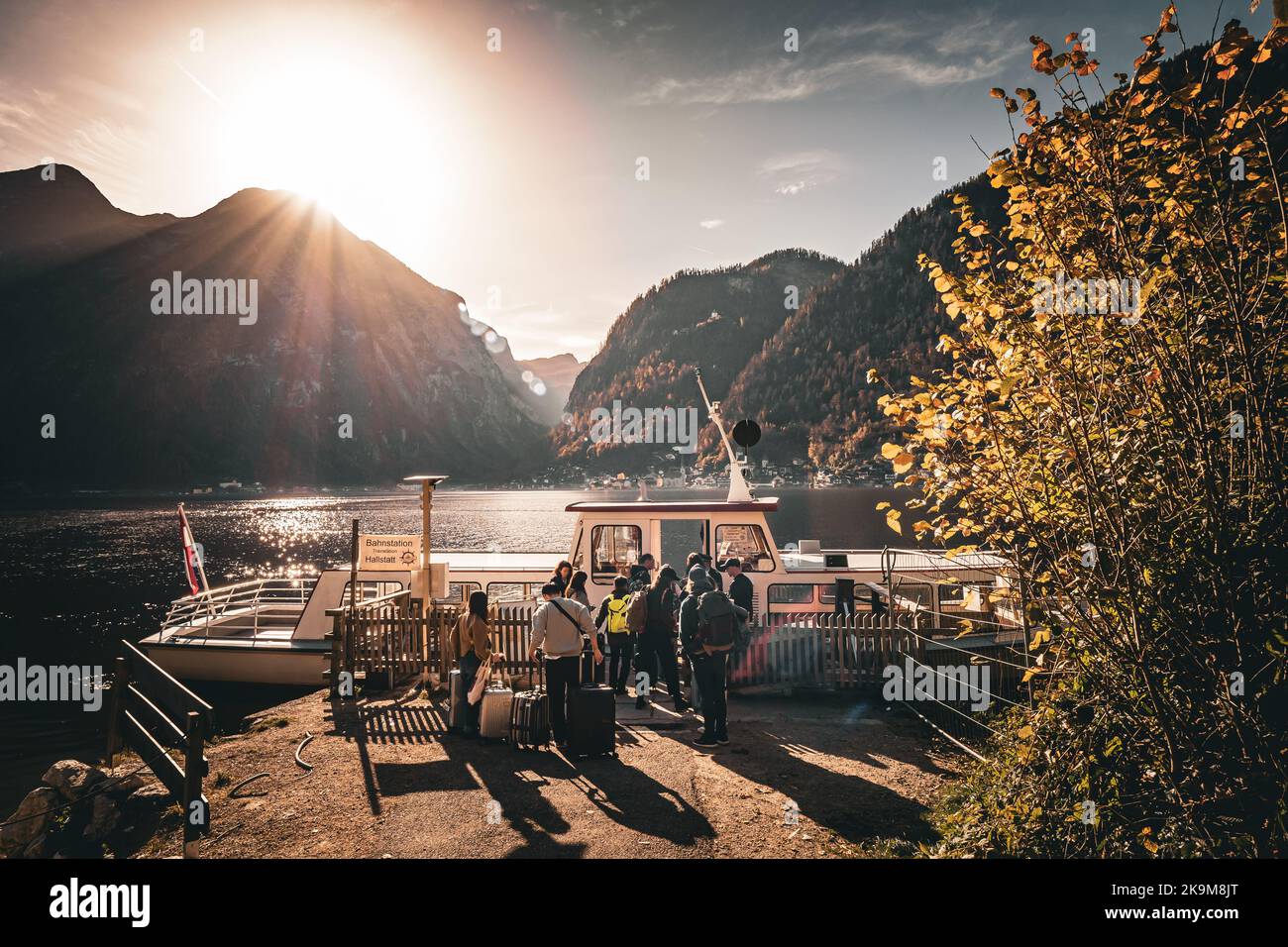 Autumn view of the Hallstatt train station landing stage on the other ...