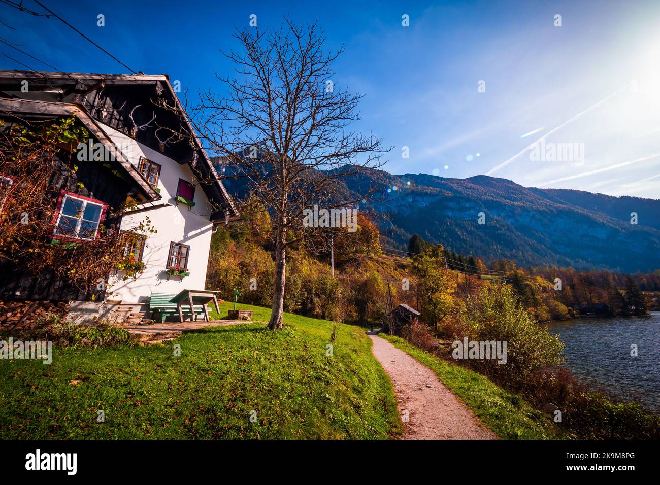 View of an old, typical Austrian residential house at the lakeshore of ...