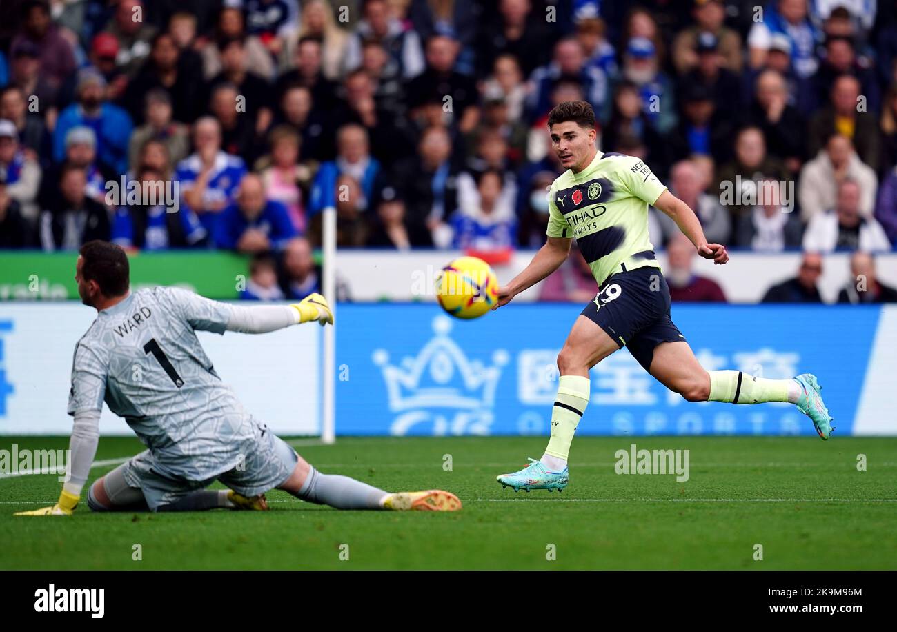 Leicester City goalkeeper Danny Ward saves a shot from Manchester City ...