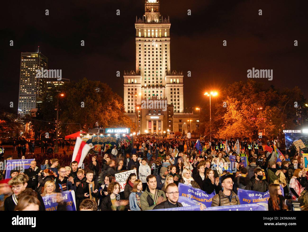 Protesters hold up signs as they take part in the 'Crisis Strike', a ...