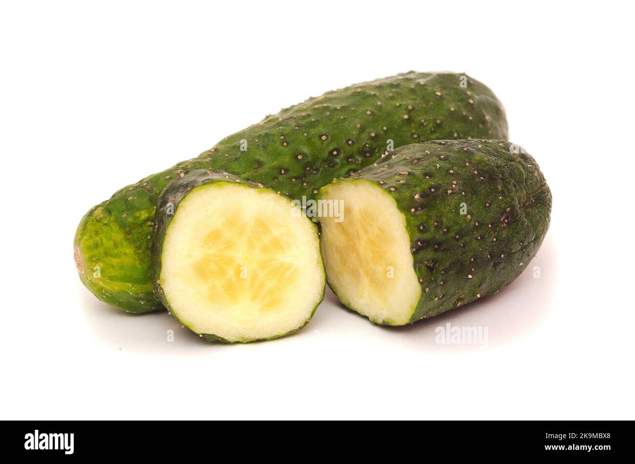 one , half and a slice of cucumber isolated on white background Stock ...