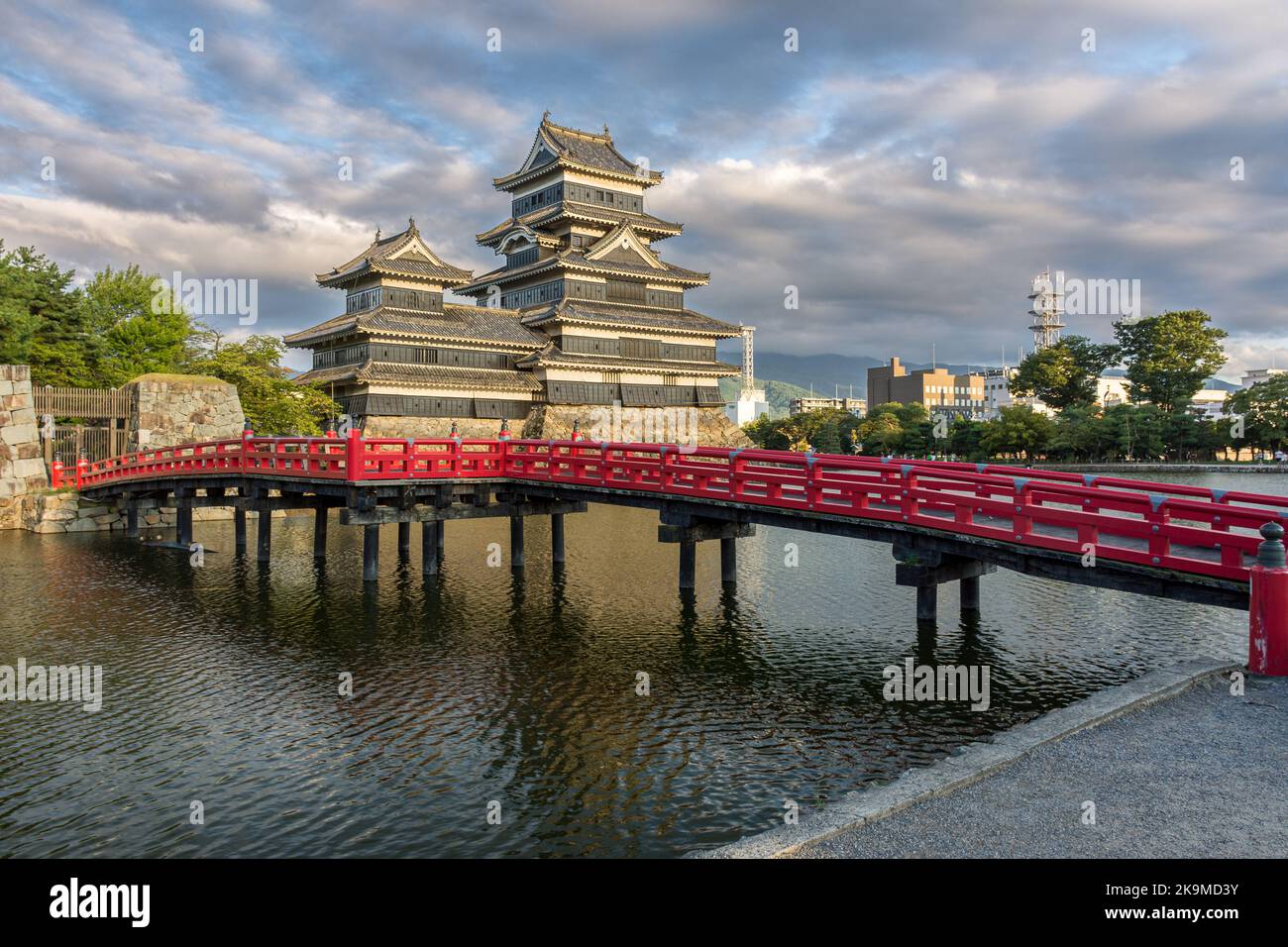 Matsumoto castle with red bridge Stock Photo - Alamy