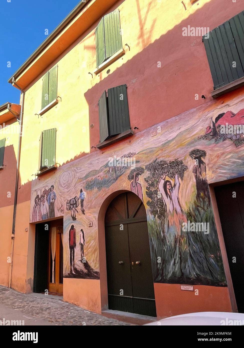 Dozza, Italy. Murals on the facade of historical buildings, created by ...