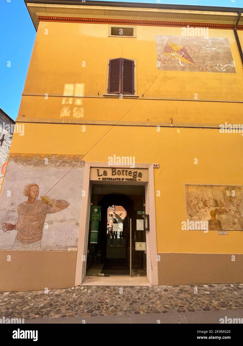 Dozza, Italy. Murals on the facade of historical buildings, created by ...