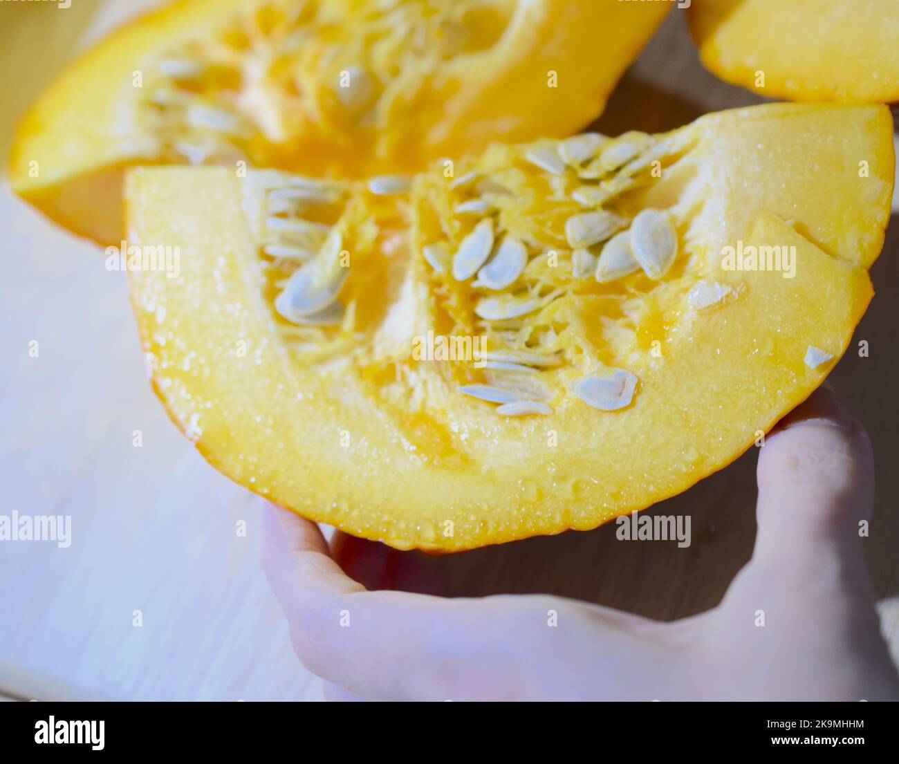 Pumpkin slice with seeds ready to cook Stock Photo - Alamy