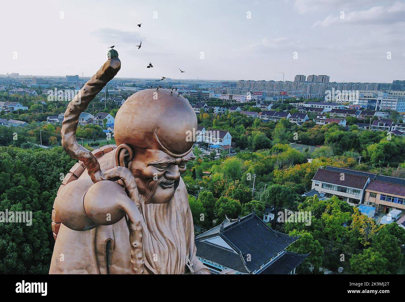 RUGAO, CHINA - OCTOBER 29, 2022 - A 49-meter-tall bronze statue of a ...