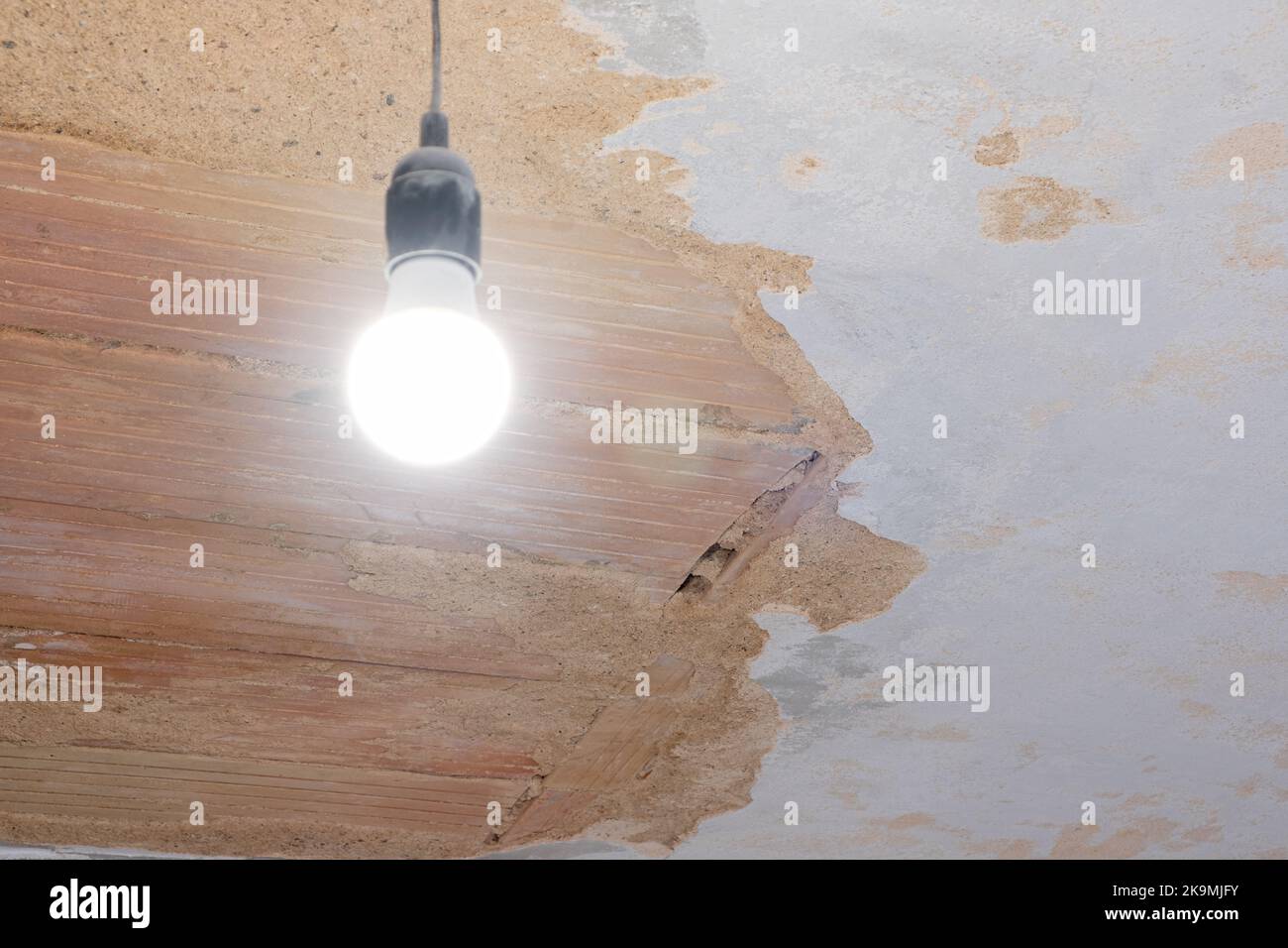 Interior reconstruction on Ruined old ceiling and hanging eco led lamp ...