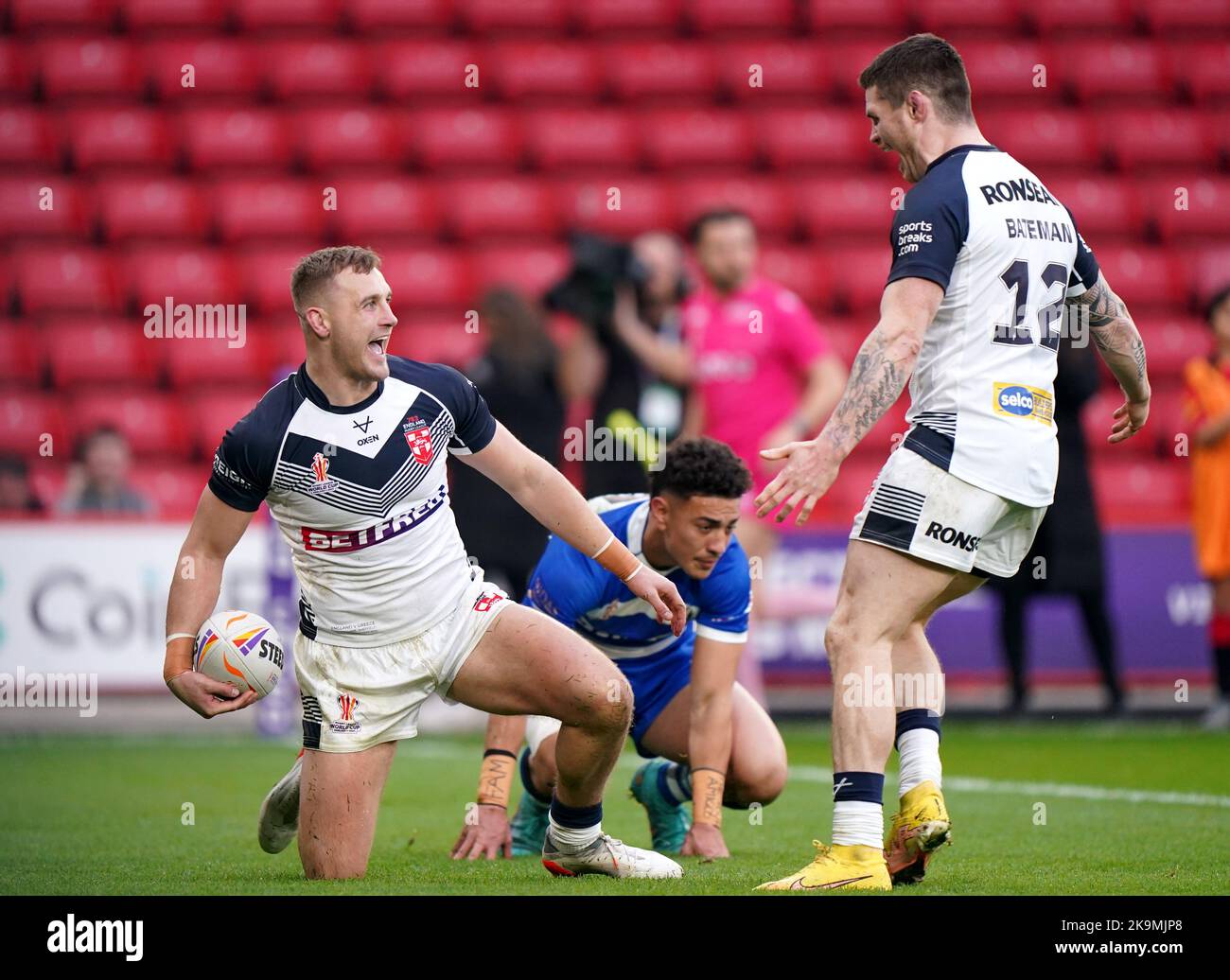 England's Matty Lees (left) celebrates scoring their side's first try ...