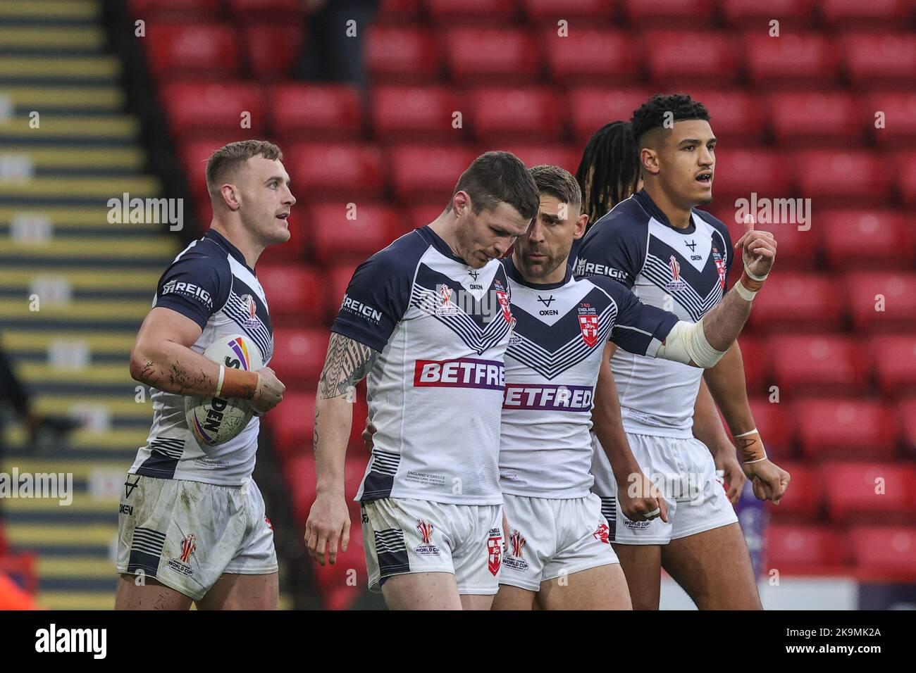 Matty Lees of England celebrates his try with team mates during the ...