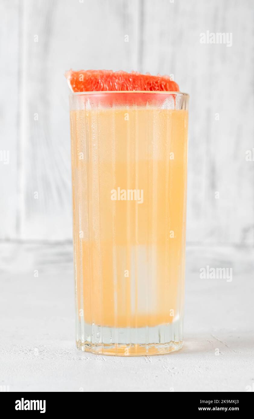 Glass of Frenchie Cocktail garnished with grapefruit wedge Stock Photo ...