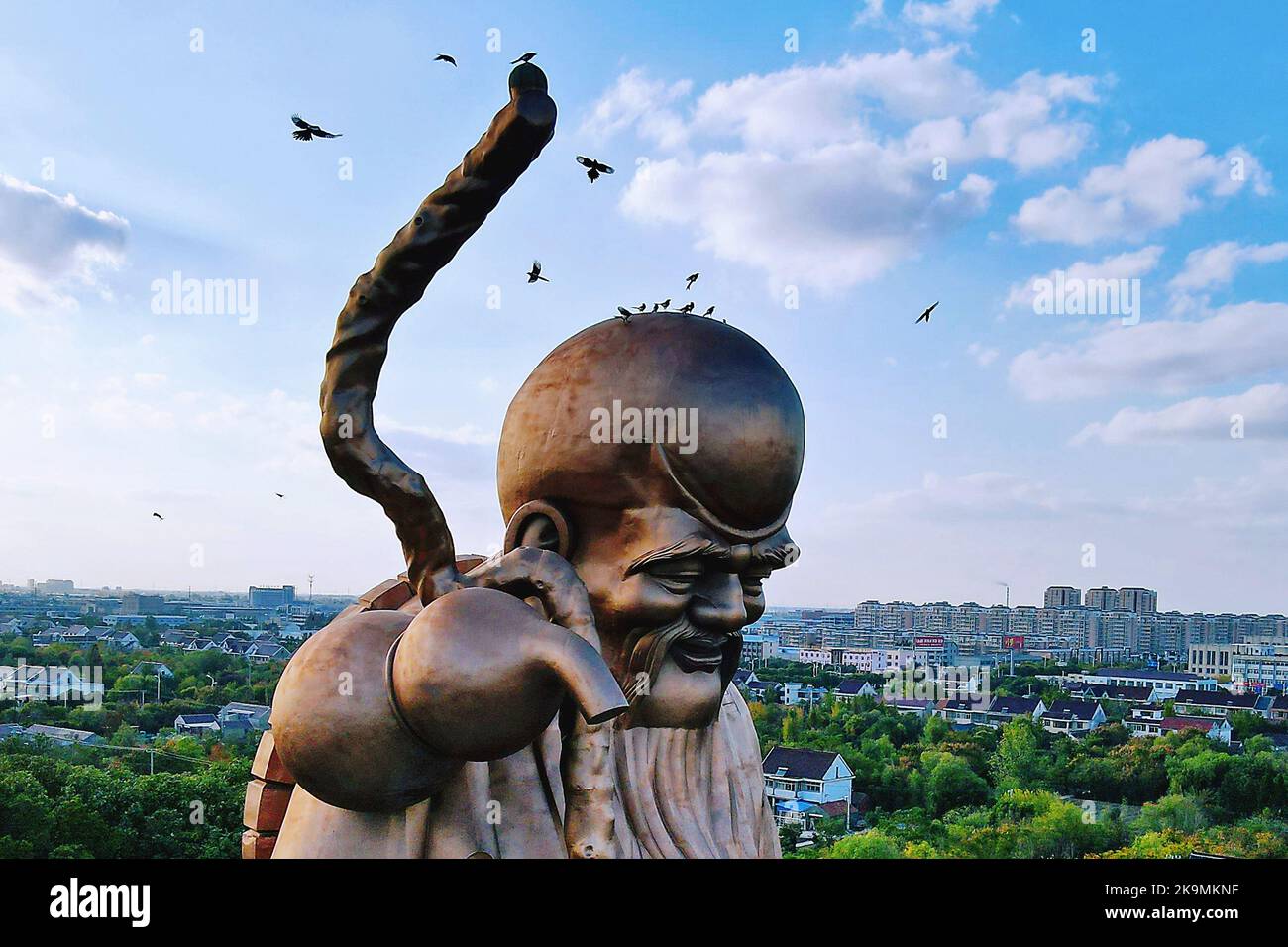 RUGAO, CHINA - OCTOBER 29, 2022 - A 49-meter-tall bronze statue of a ...