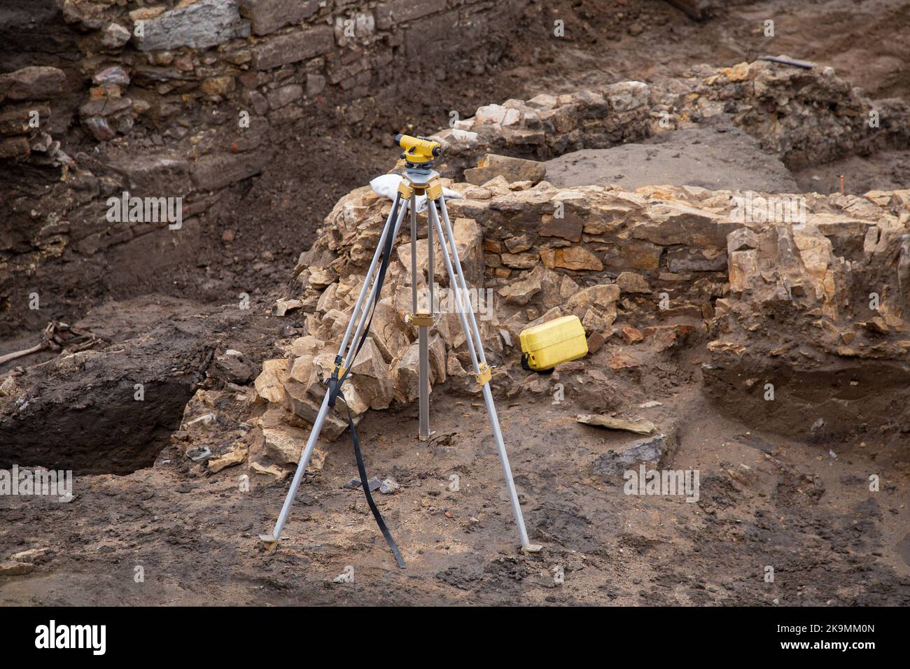 the optical level Optical level on a tripod at the site of field ...
