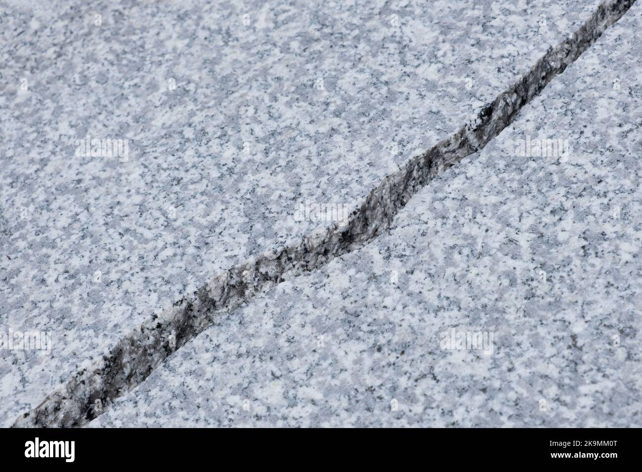 crack in a light granite natural stone Stock Photo - Alamy