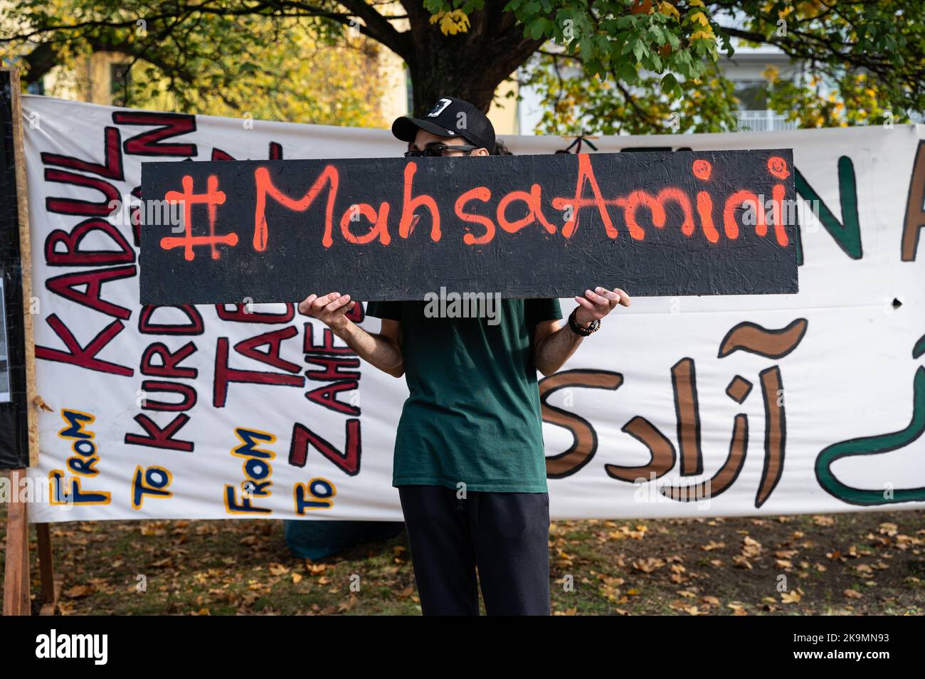 22.10.2022, Berlin, Germany, Europe - An activist holds a sign in ...