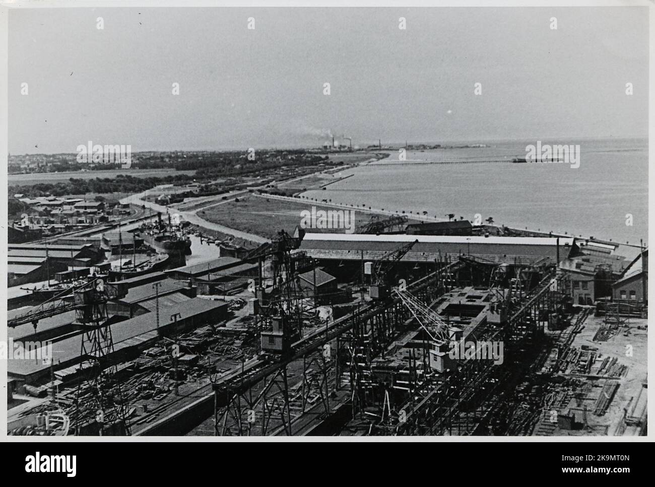 Kockum's shipyard. Limhamn in the background Stock Photo - Alamy