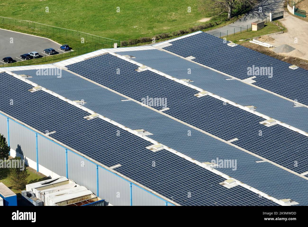 Aerial view of solar power plant with blue photovoltaic panels mounted ...