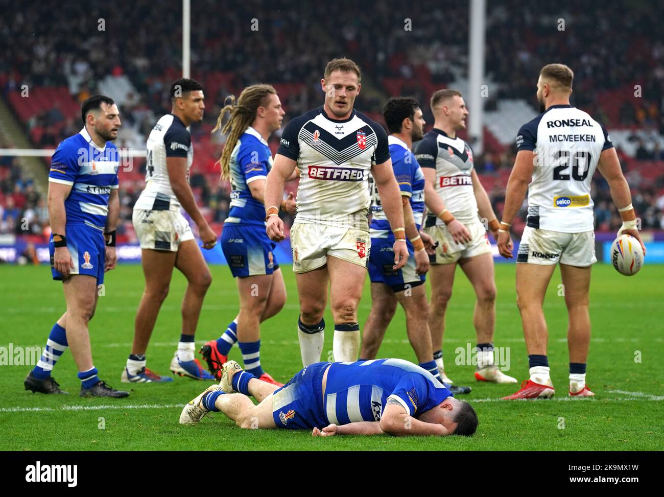 Greece's Jordan Meads (ground) reacts to an injury, shortly before a ...
