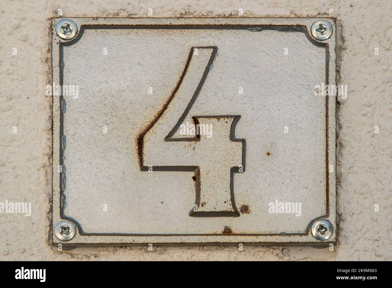 Old retro weathered cast iron plate with number 4 closeup Stock Photo ...