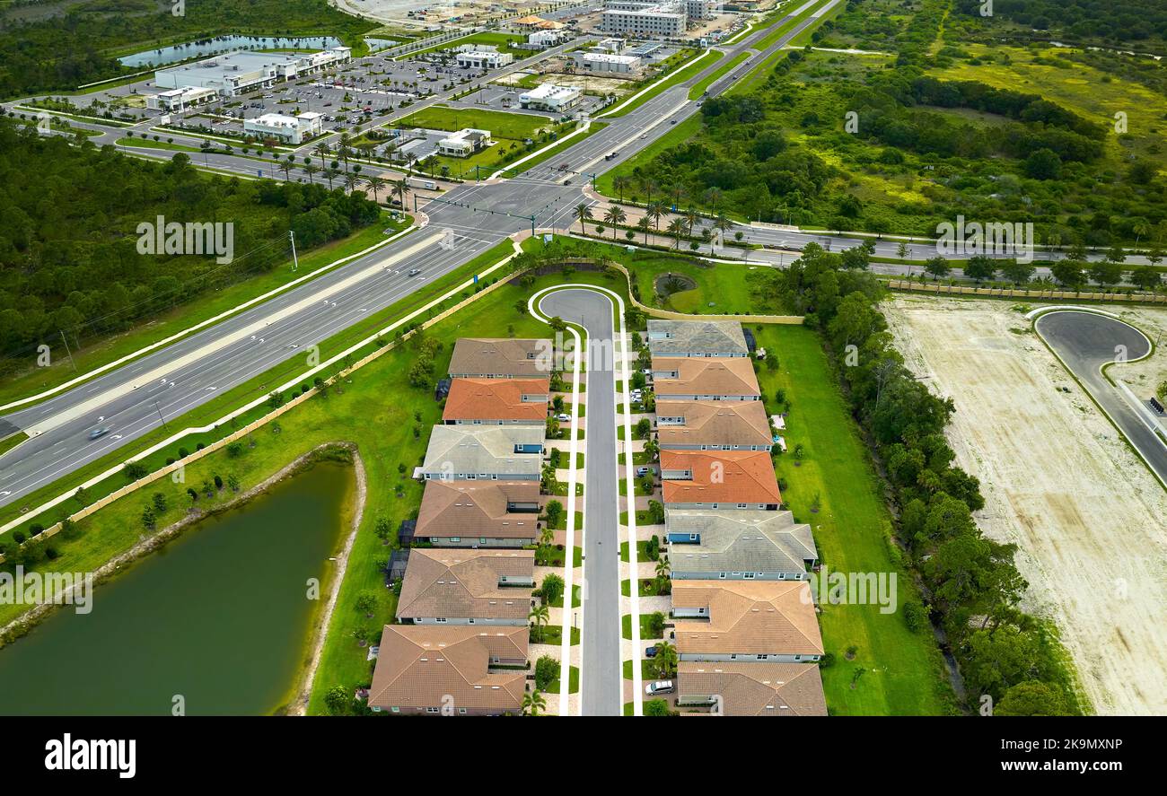Aerial view of real estate development with tightly located family ...