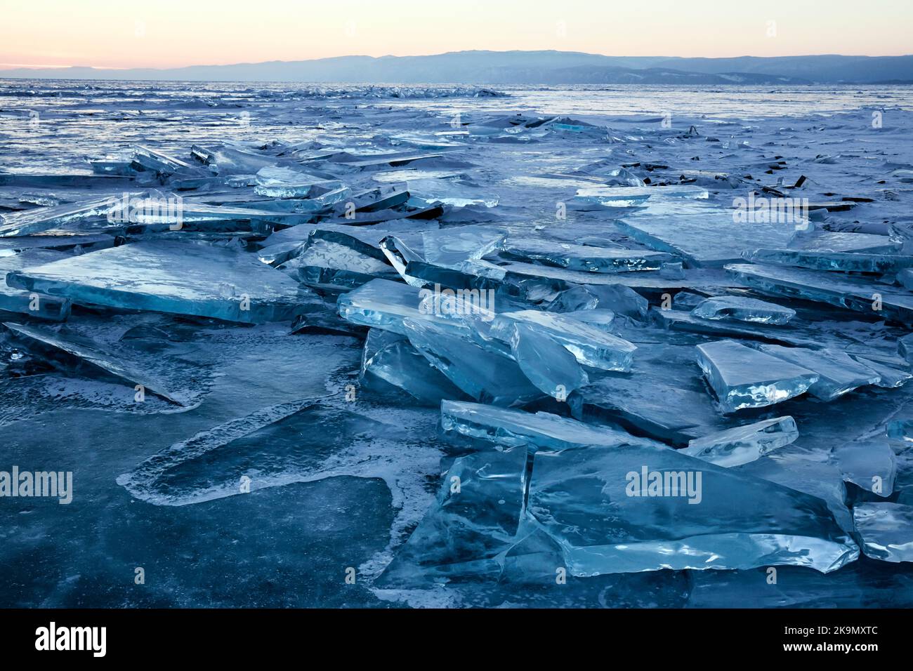 Piled up ice blocks on lake Baikal Stock Photo - Alamy